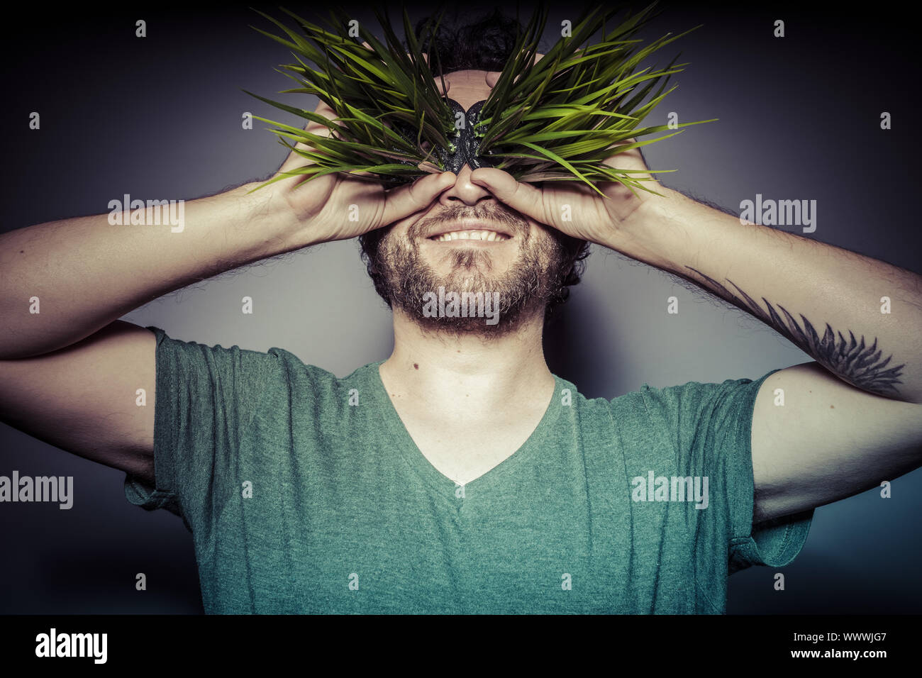 Cannabis, Concept of addiction to drugs, man with grass in eyes with ...
