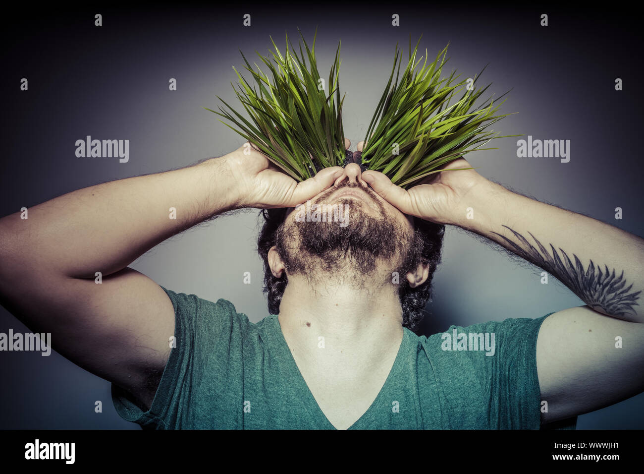 Cannabis, Concept of addiction to drugs, man with grass in eyes with ...