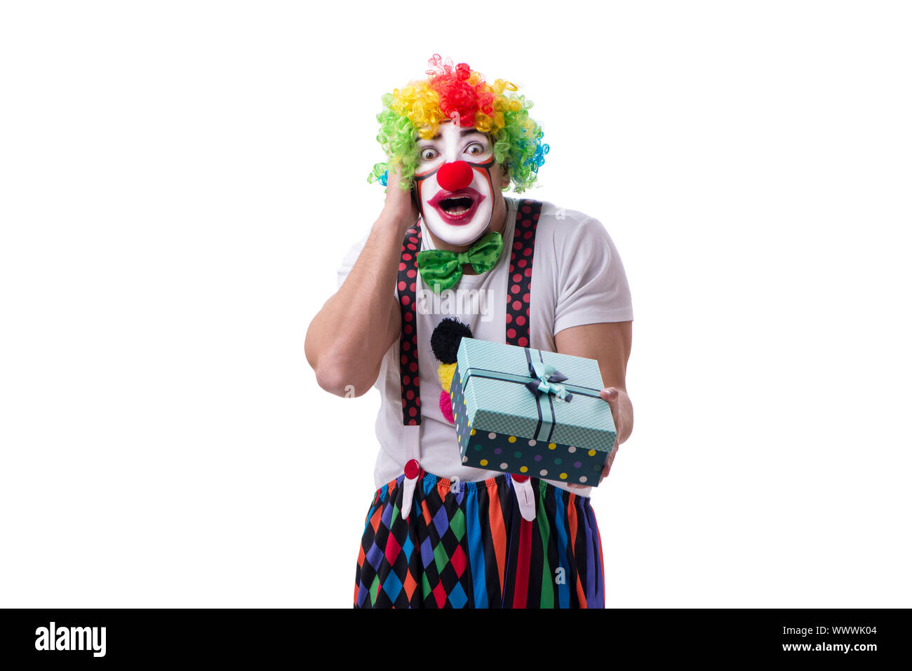 Funny clown with a gift present box isolated on white background Stock ...