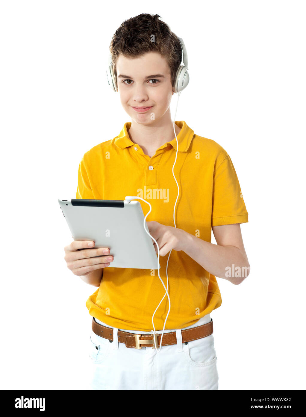 Smart boy using touch screen device against white background Stock ...
