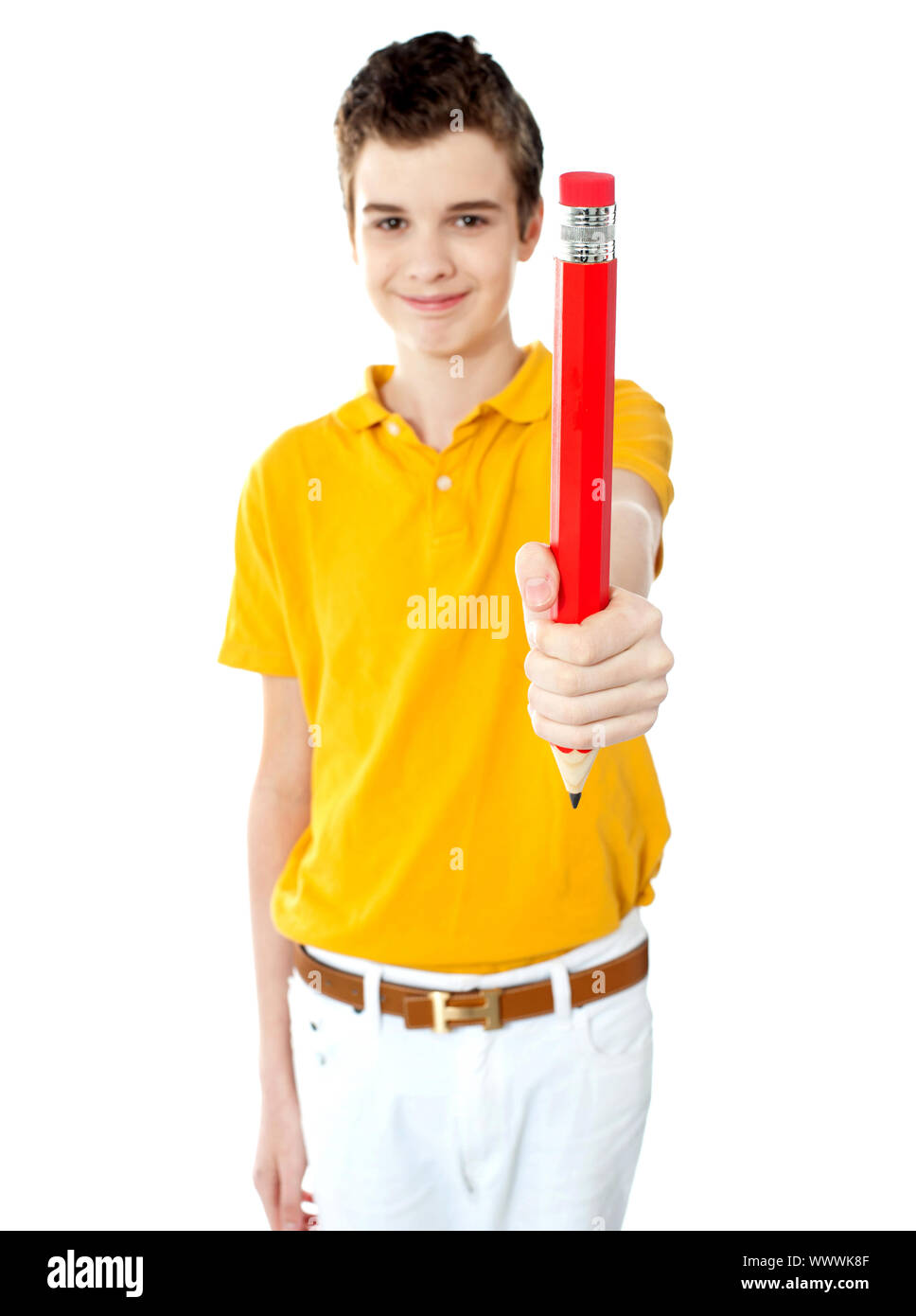 Smiling school boy offering large red pencil to you Stock Photo - Alamy