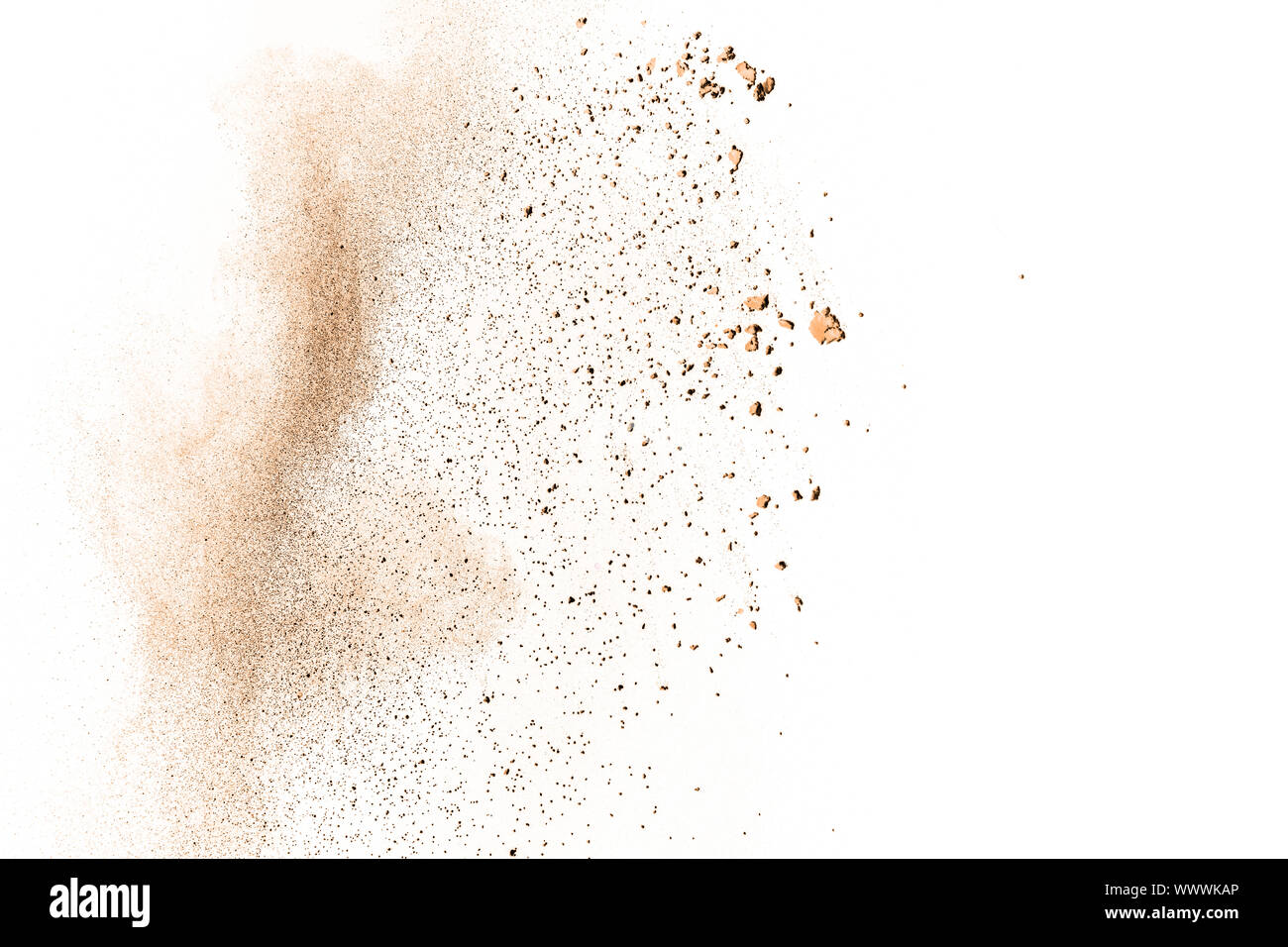 Freeze motion of brown powder exploding. Abstract design of brown dust ...