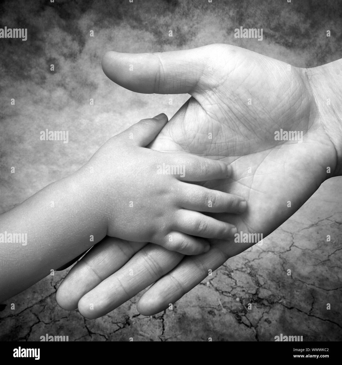 hand holds the hand of his father's son Stock Photo - Alamy
