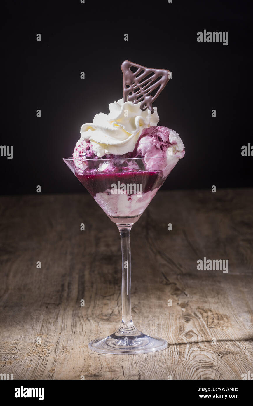 Vanilla ice cream with hot blueberries Stock Photo - Alamy