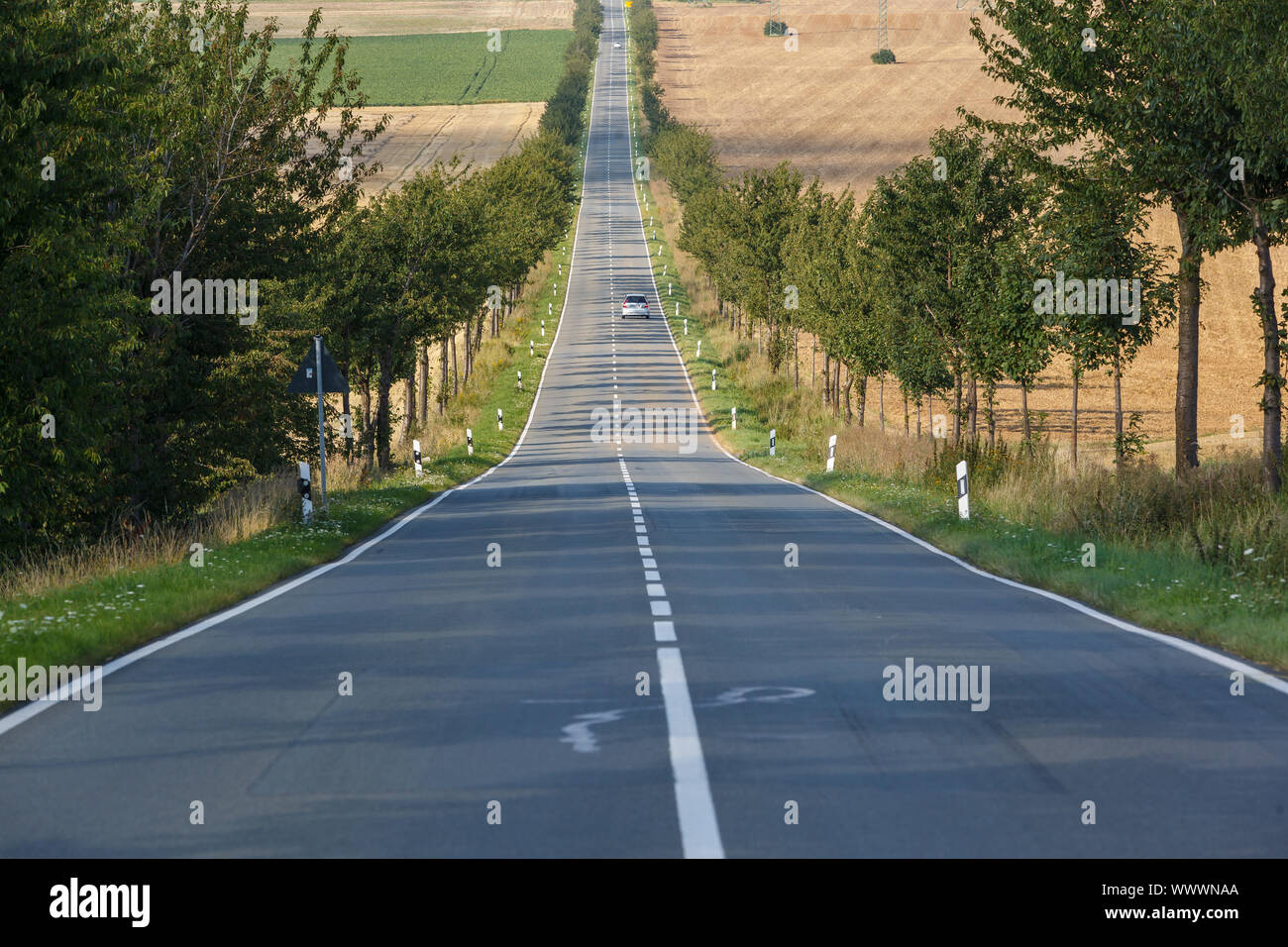 Country road straight routing Stock Photo - Alamy
