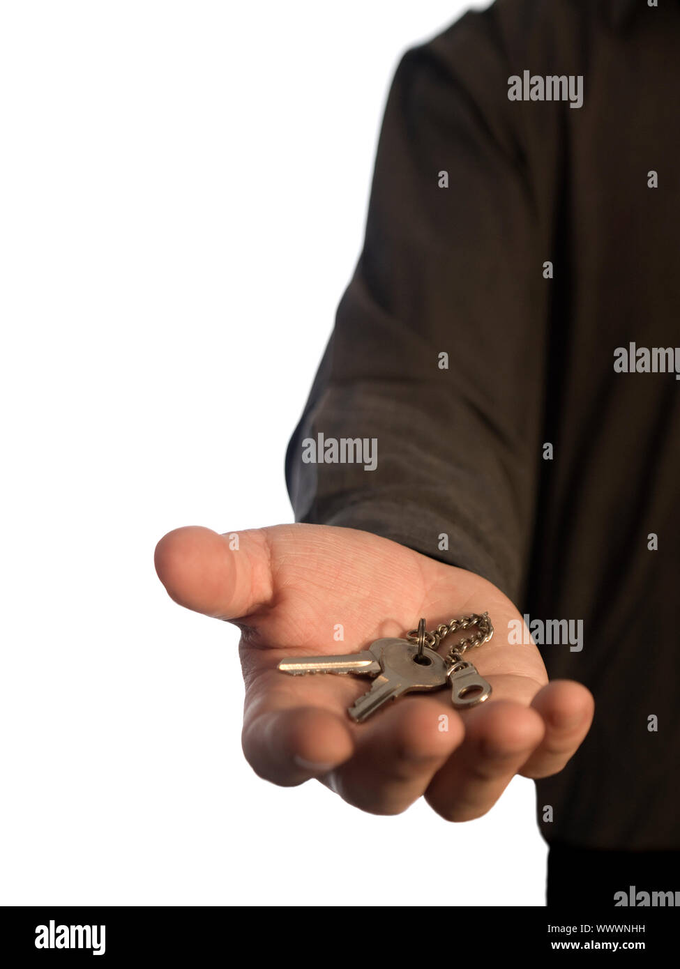 A man holding a pair of keys on his hand over a white background Stock ...
