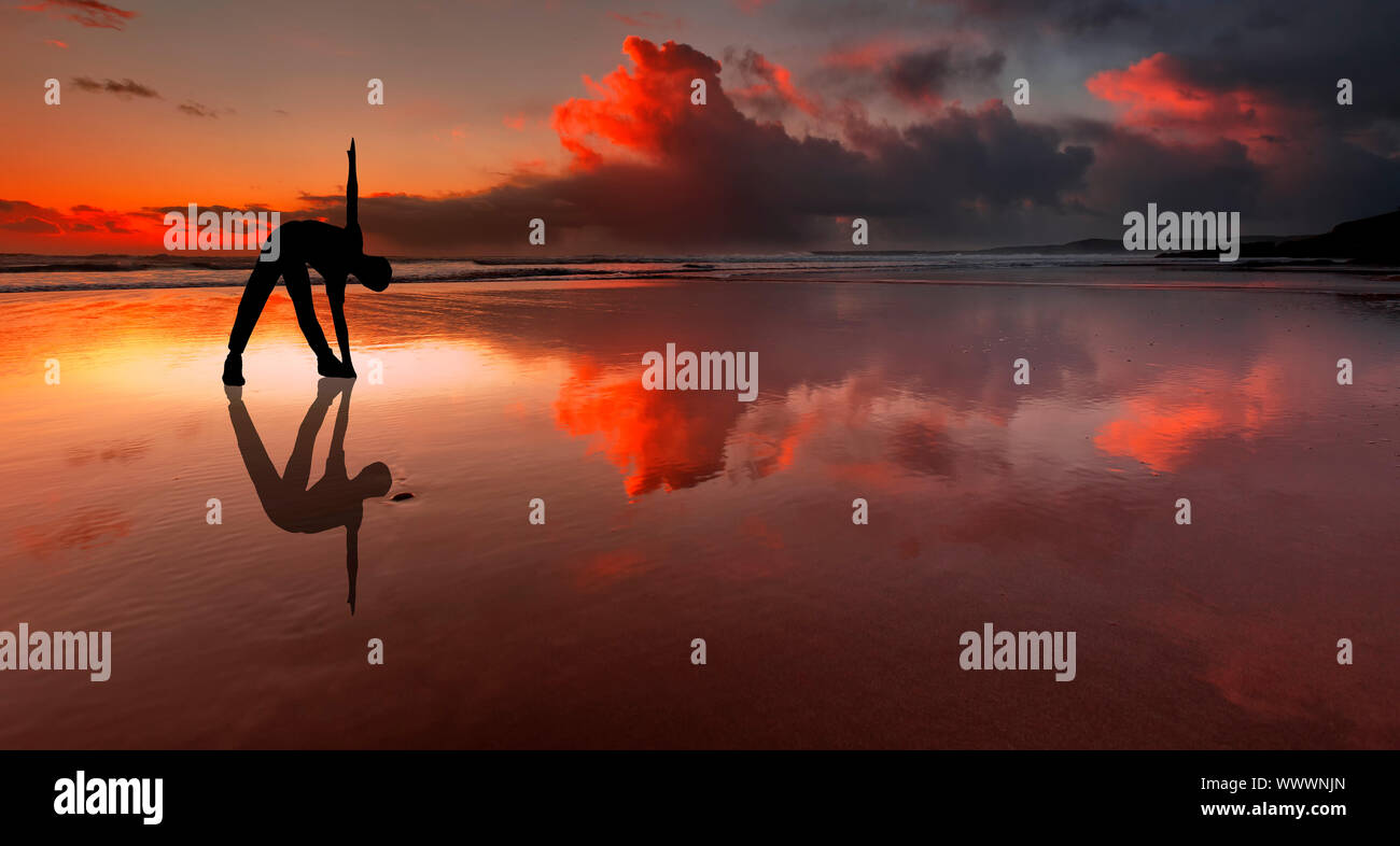 Silhouette of a someone bending over touching their left foot with ...
