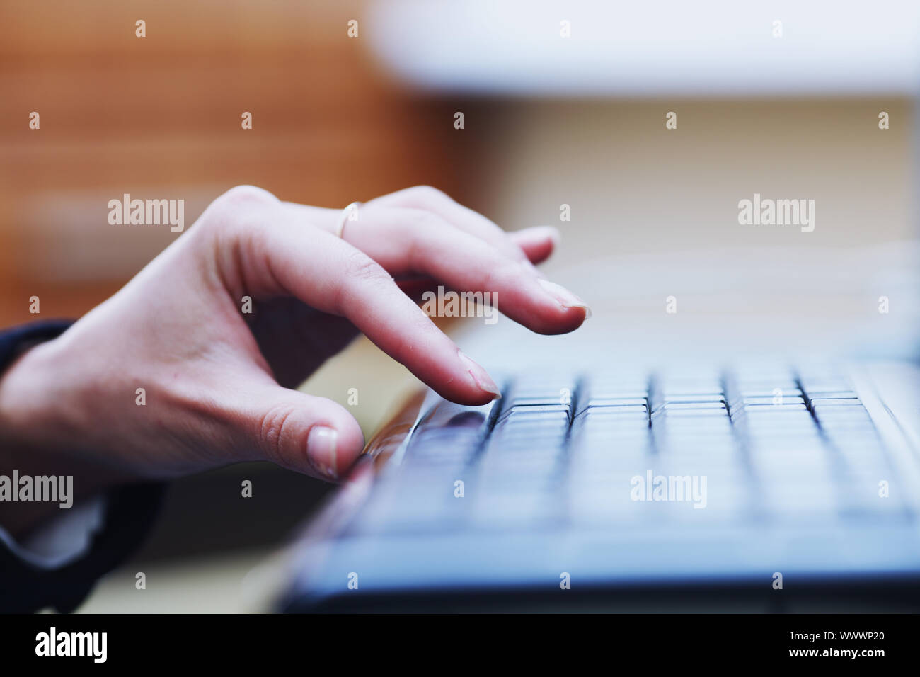 human hand going to press key on keyboard Stock Photo - Alamy