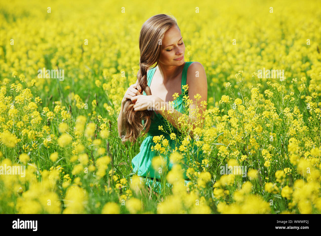 woman on oilseed field Stock Photo - Alamy