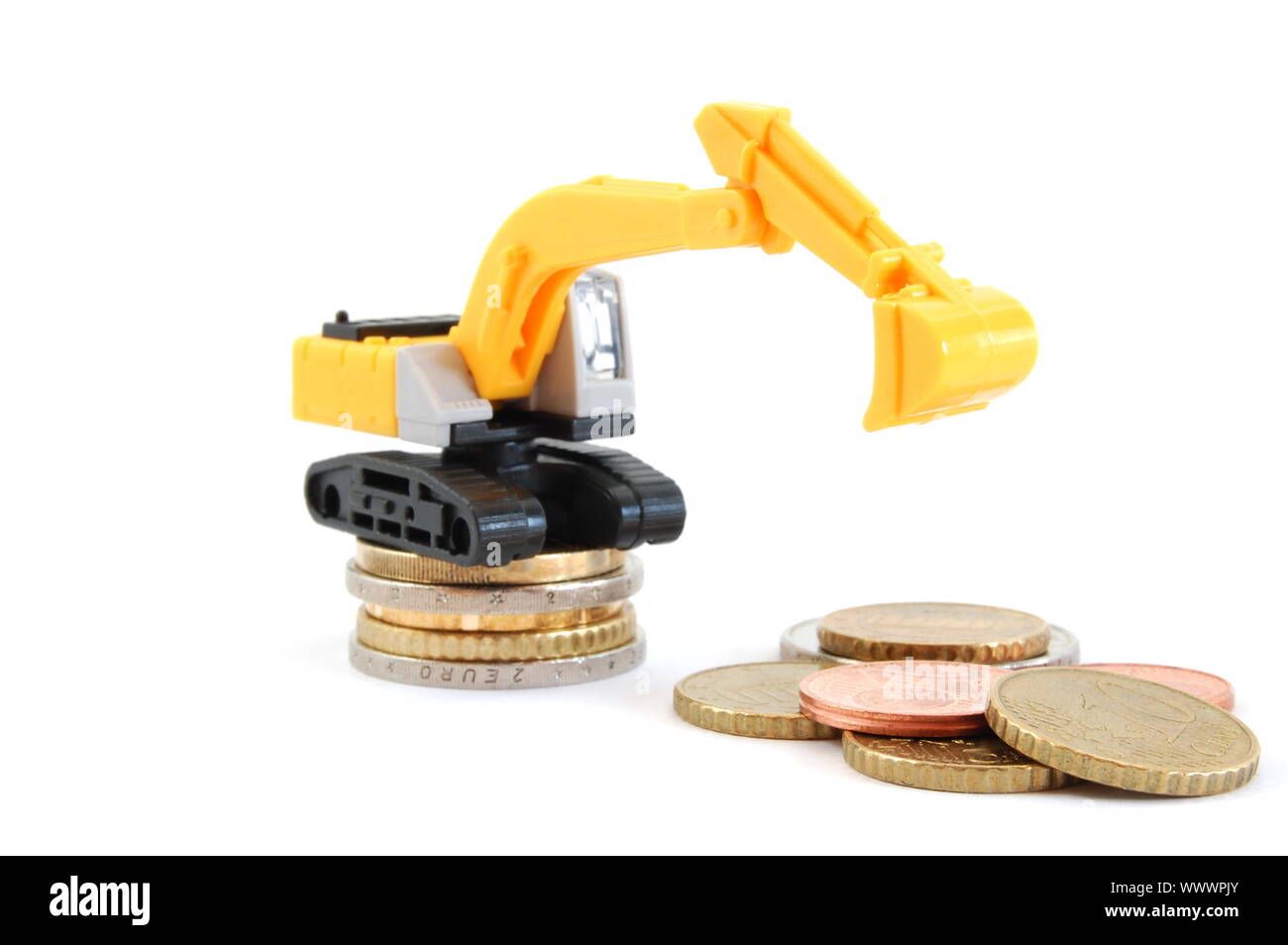 making euro money coins with digger isolated on white background Stock ...
