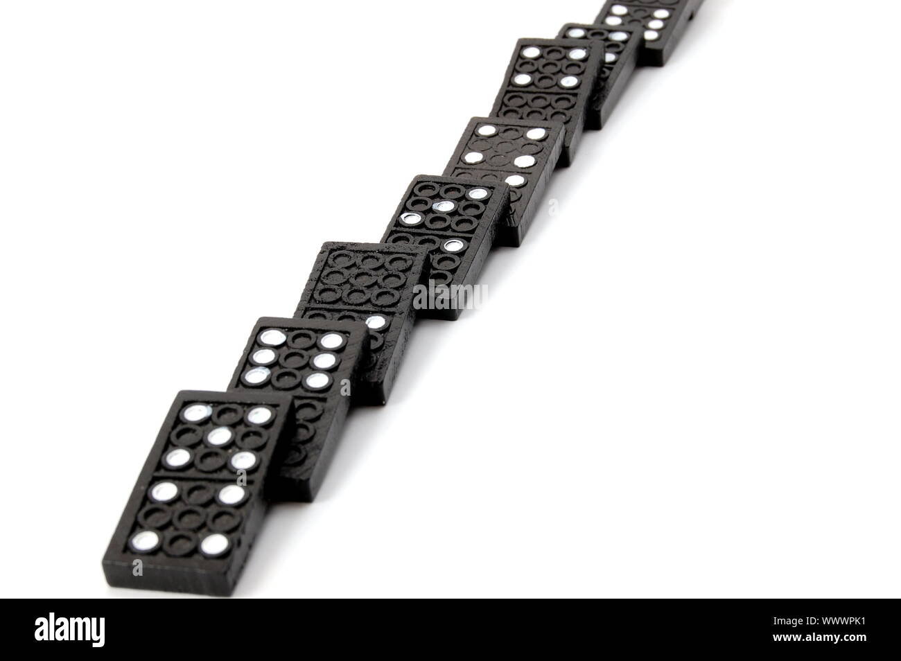 chain of dominoes isolated on a white background Stock Photo - Alamy