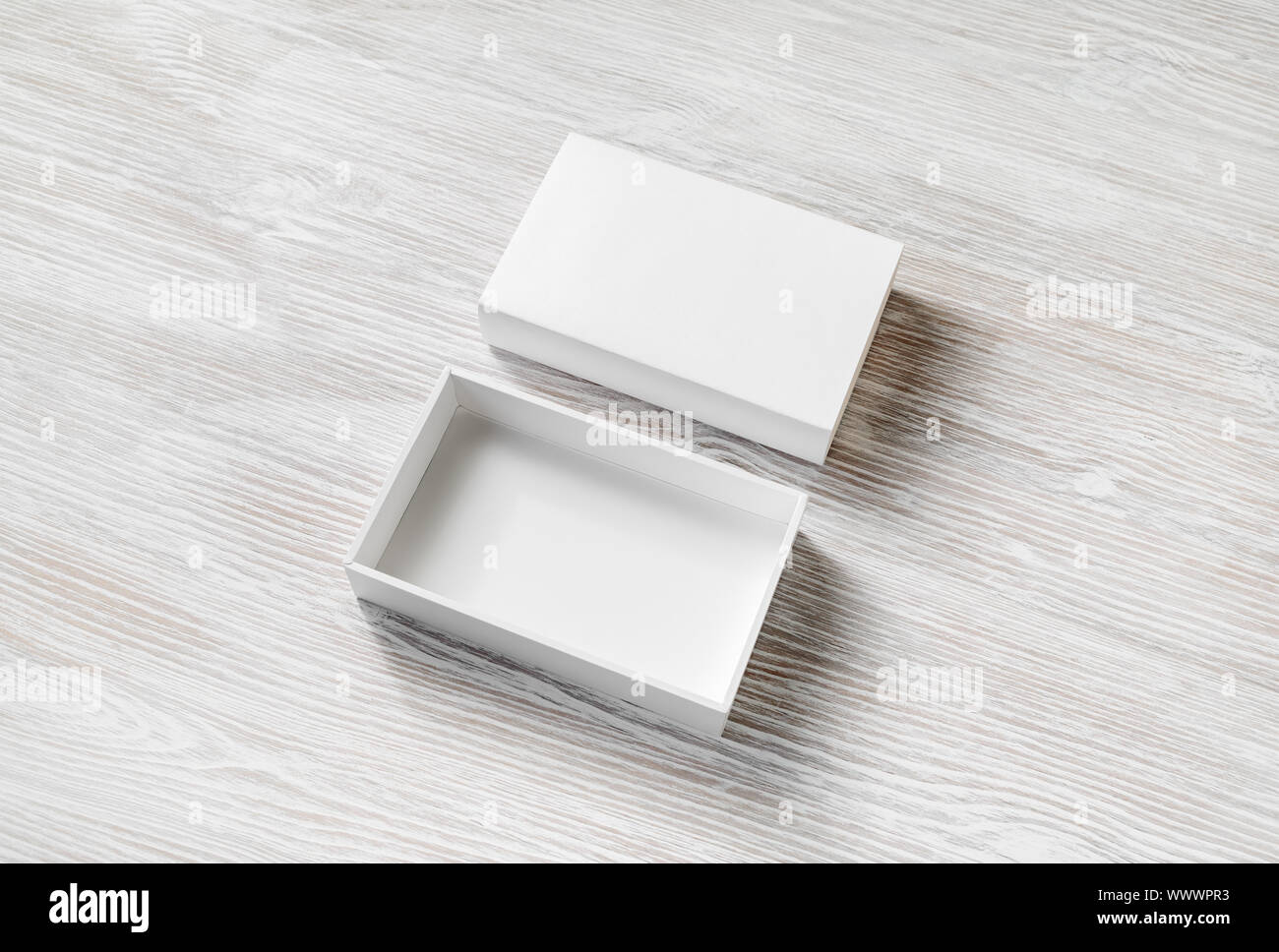 Blank white opened box on light wood table background Stock Photo - Alamy