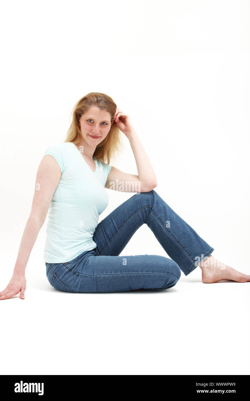 Girl Sitting Up Straight But Comfortable On The Floor Leaning Her Elbow