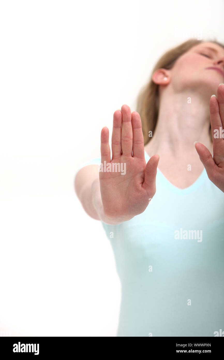 Woman throwing back her head in abandonment and rejection giving a Stop ...