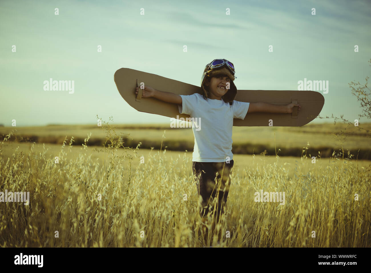 Retro, Boy playing to be airplane pilot, funny guy with aviator cap and ...