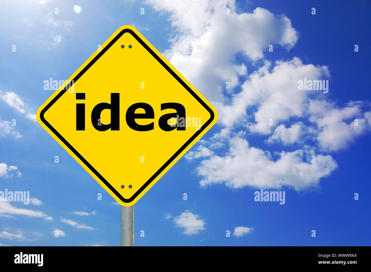 creativity and idea concept with yellow road sign Stock Photo - Alamy