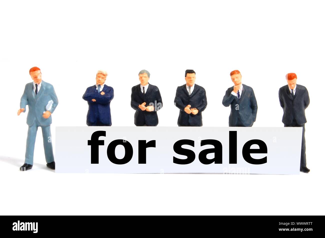 for sale concept with toy business man isolated on white background ...