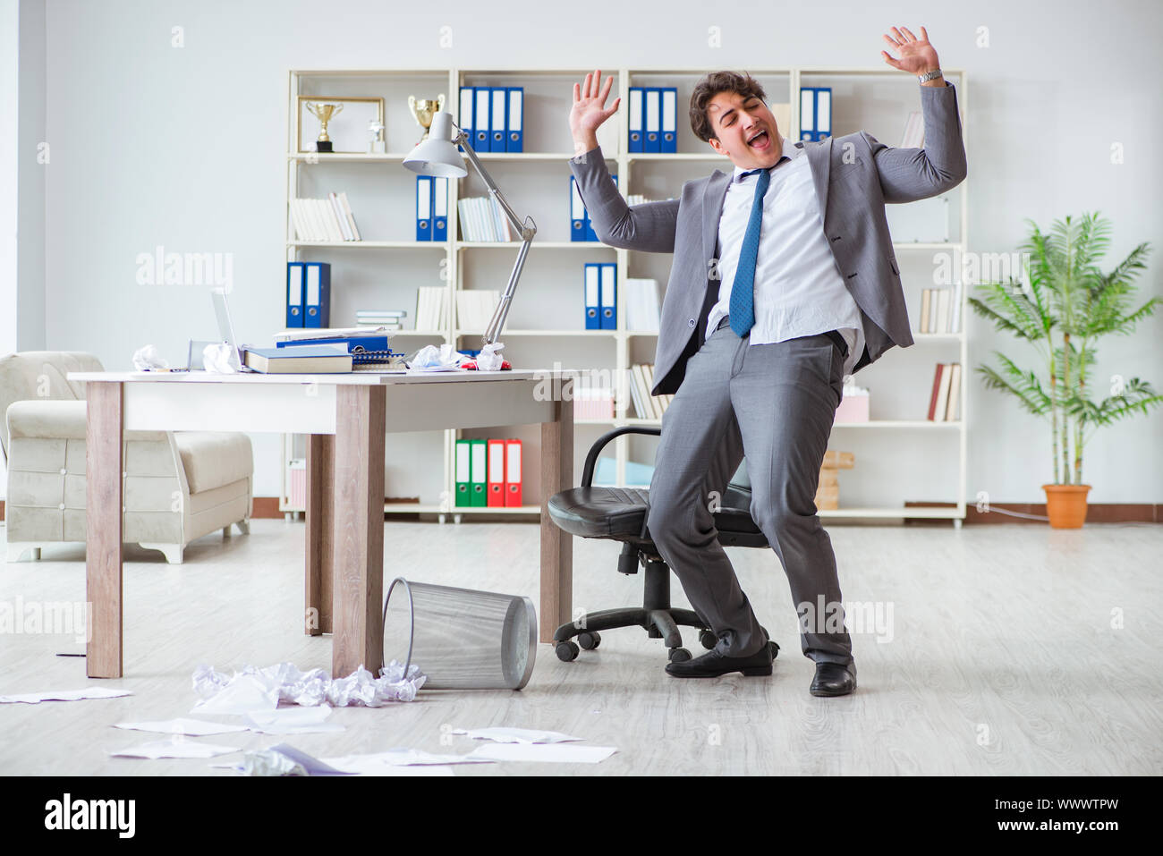 Businessman having fun taking a break in the office at work Stock Photo ...