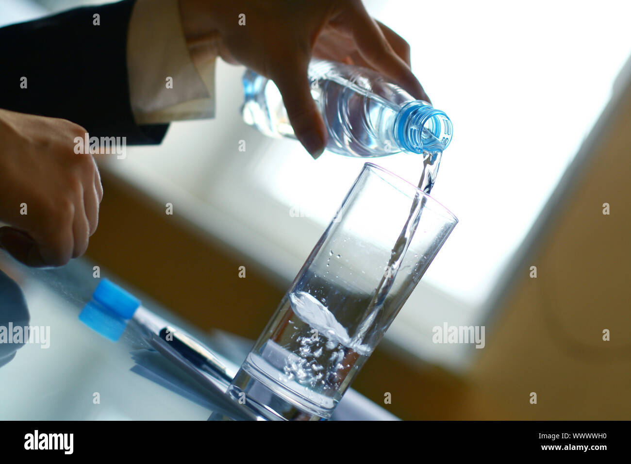 filling glass with water Stock Photo - Alamy