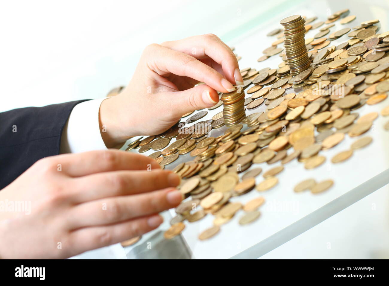 hand make coins piles on white Stock Photo - Alamy