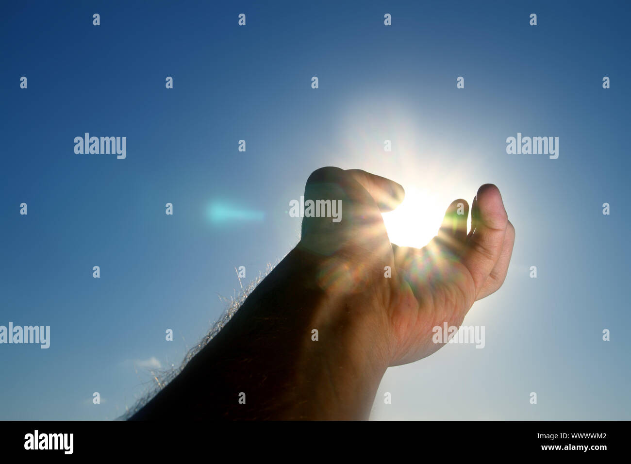 hand take the sun city in dark Stock Photo - Alamy