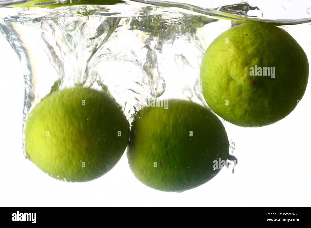 lime splash isolated on white background Stock Photo - Alamy