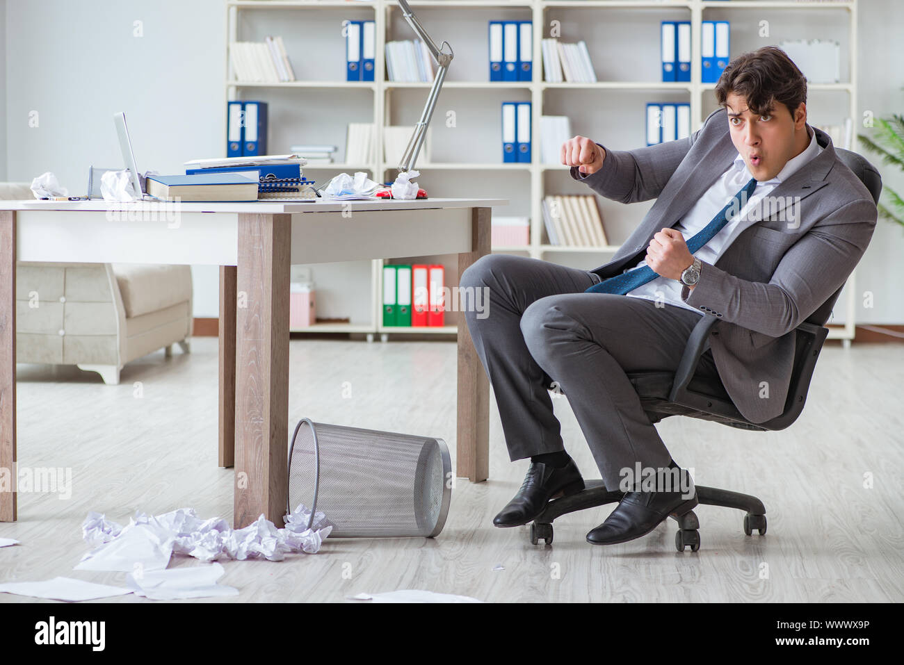 Businessman having fun taking a break in the office at work Stock Photo ...