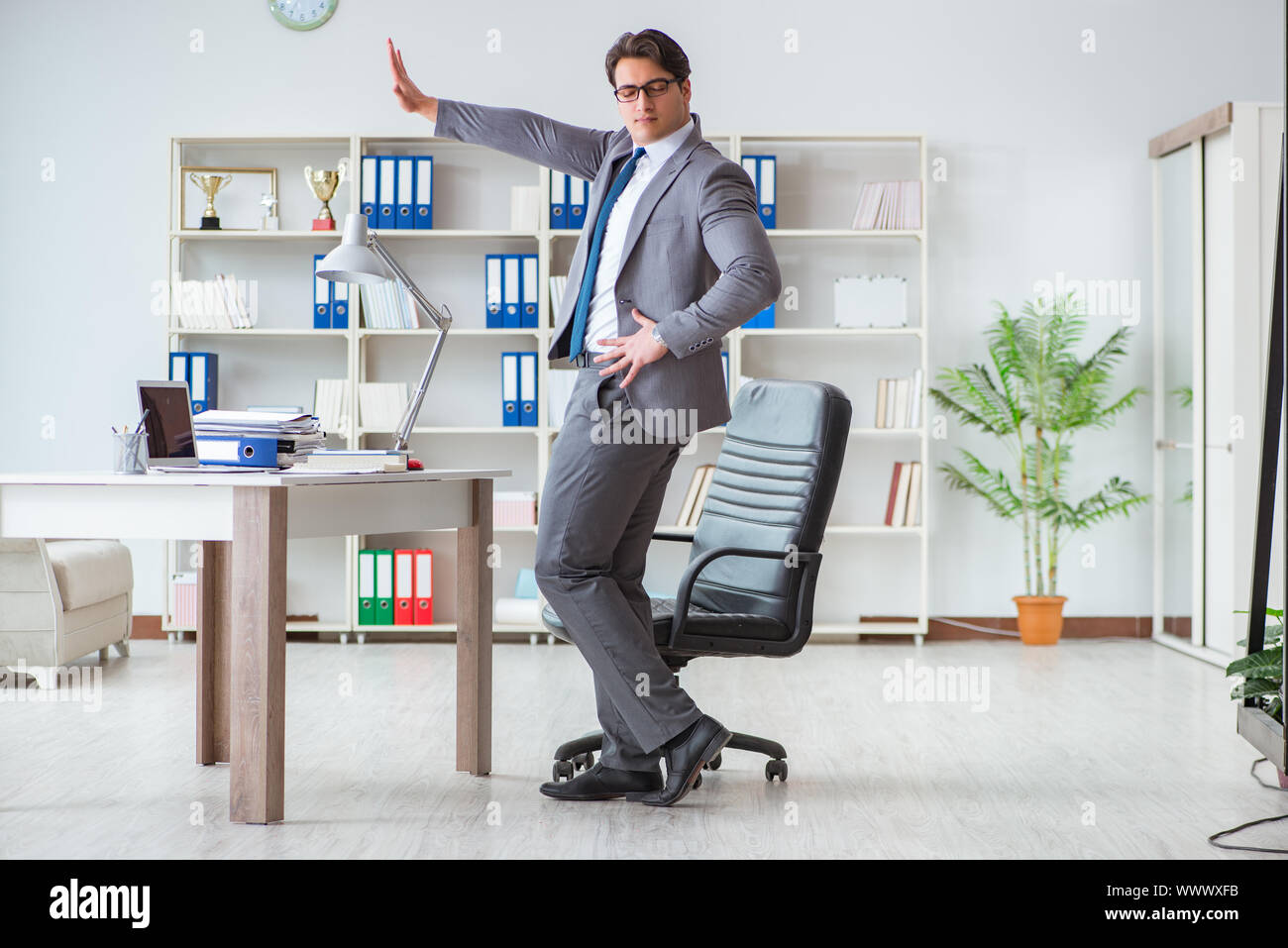 Businessman having fun taking a break in the office at work Stock Photo ...