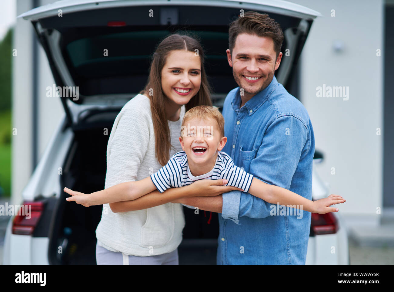 Happy family going for a trip by car Stock Photo - Alamy