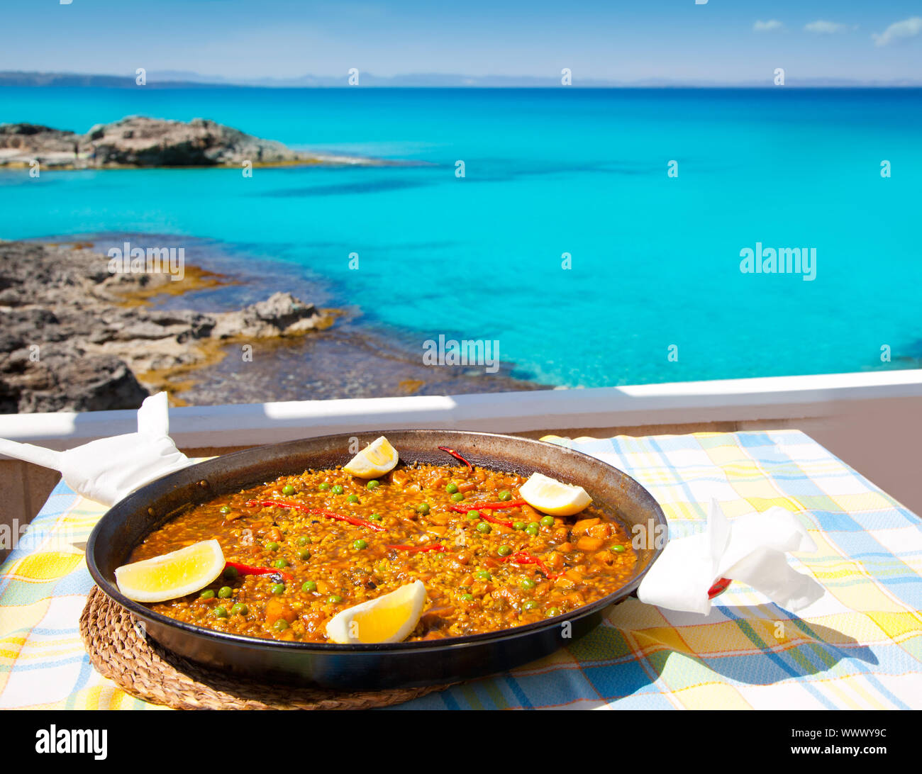Paella mediterranean rice food by the Balearic Formentera island beach ...