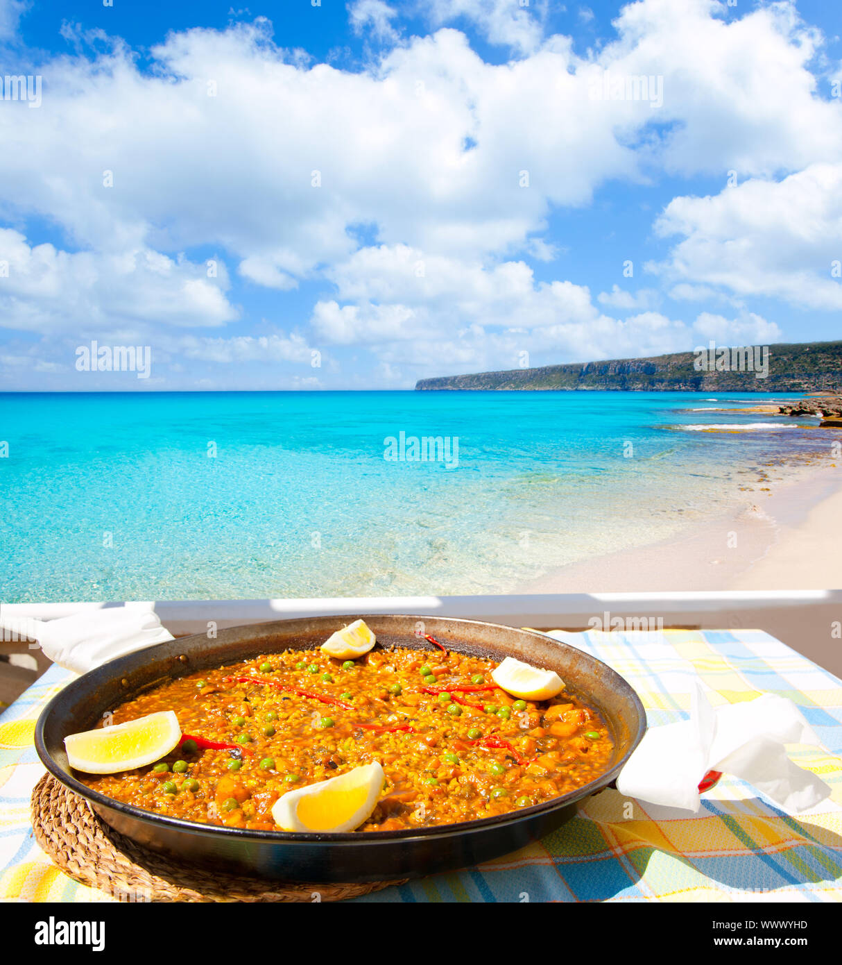 Paella mediterranean rice food by the Balearic Formentera island beach ...