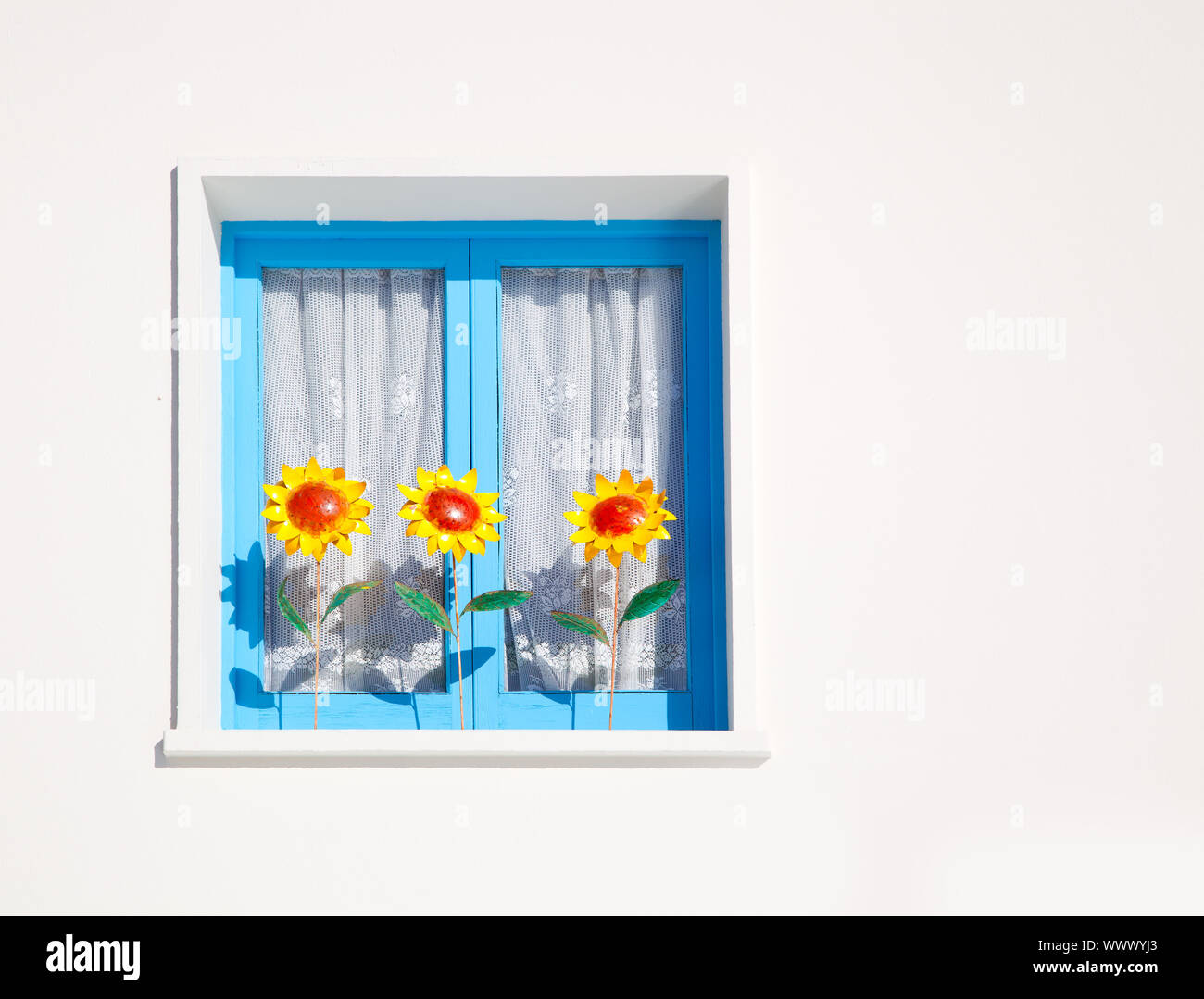 Balearic blue window with three sunflowers Mediterranean architecture ...