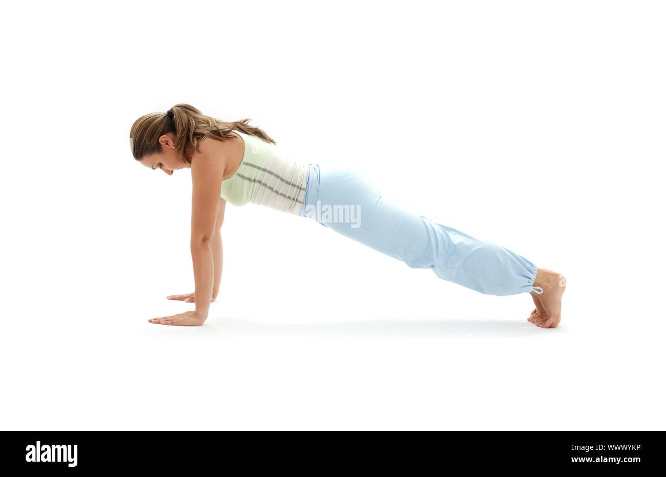 sporty girl practicing chaturanga dandasana four-limbed staff pose ...