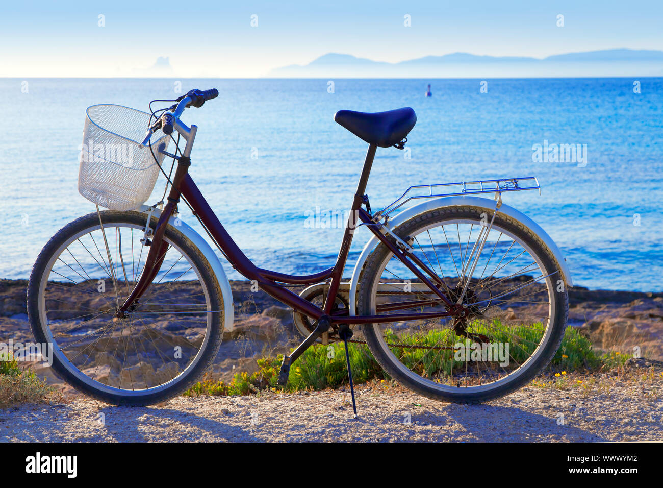 Bicycle in formentera beach on Balearic islands with Ibiza sunset ...