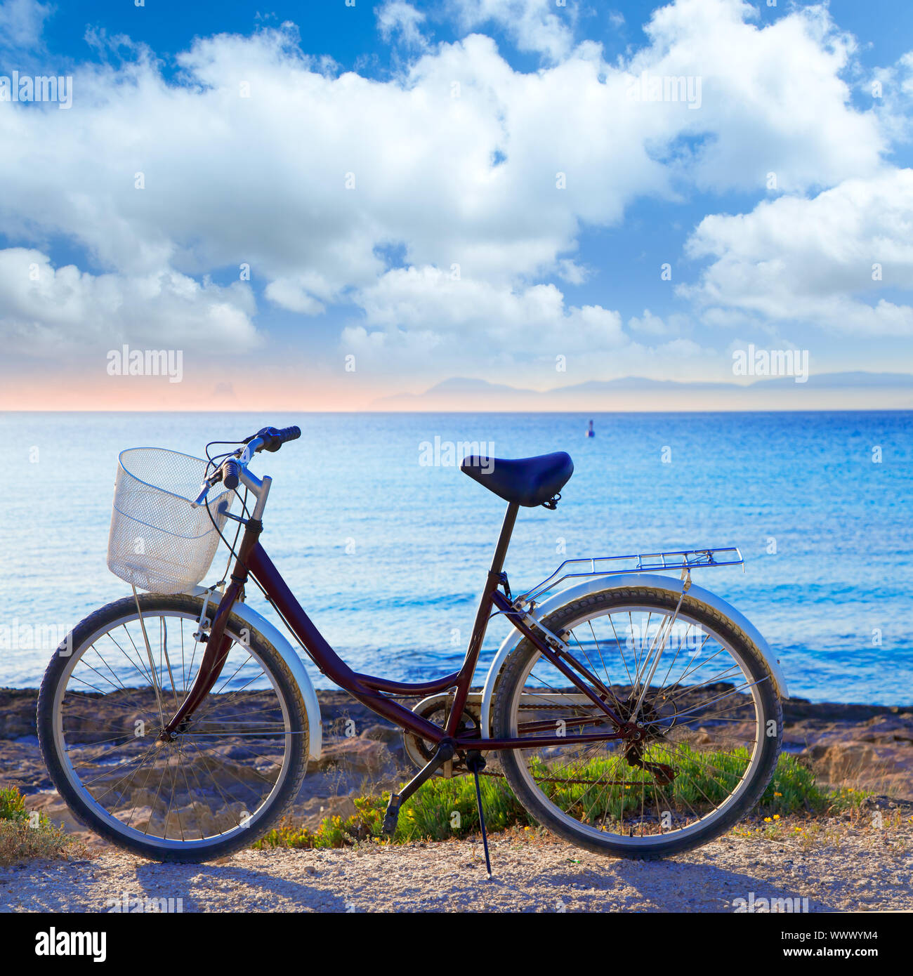 Bicycle in formentera beach on Balearic islands with Ibiza sunset ...