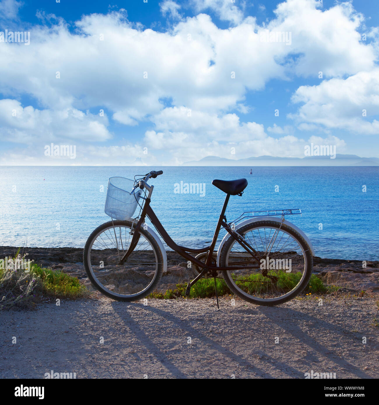 Bicycle in formentera beach on Balearic islands with Ibiza sunset ...