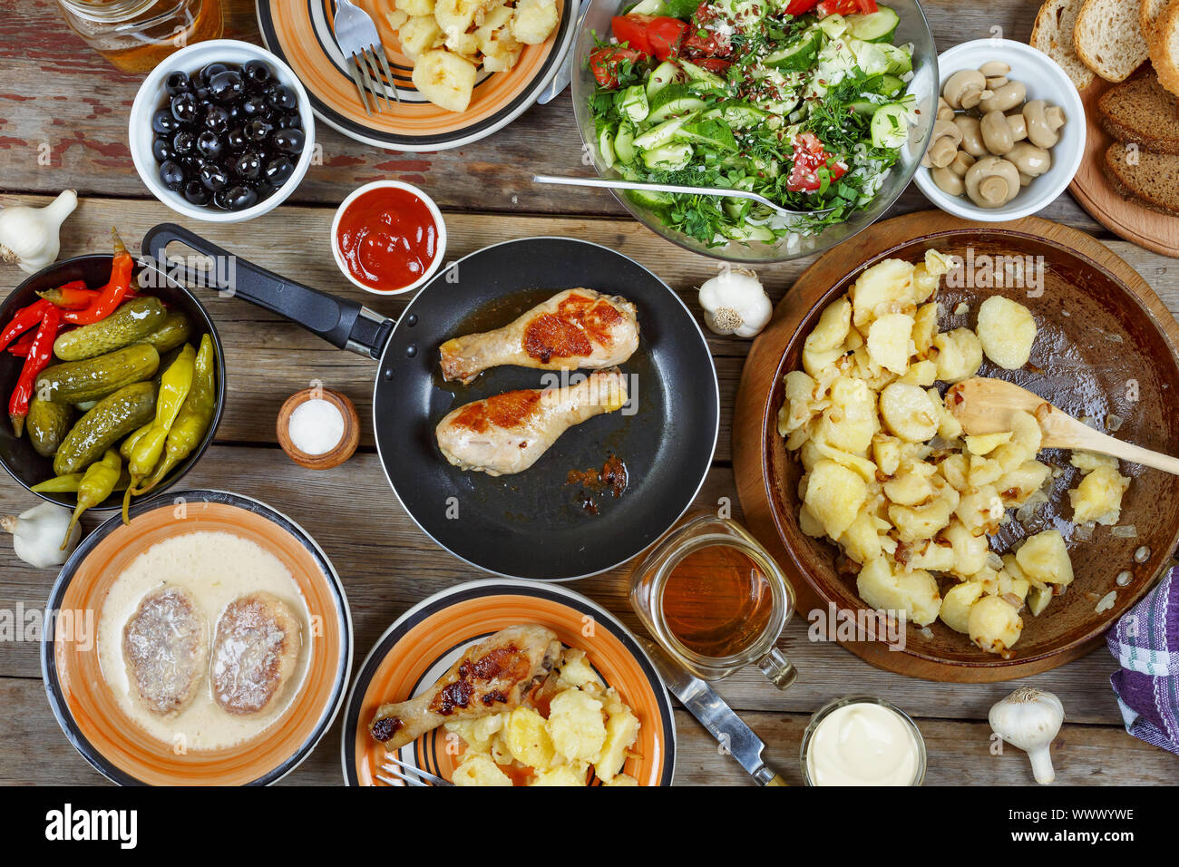 various Traditional American snacks with grilled chicken legs and fried ...