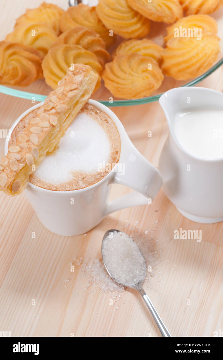 breakfast with coffee and fresh baked pastry over a natural pine wood ...