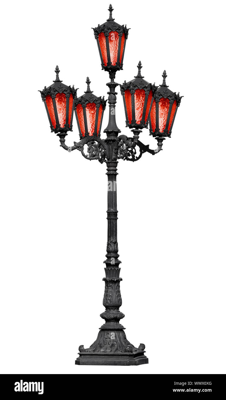 The old cast iron lamp post with red glass isolated on white background ...