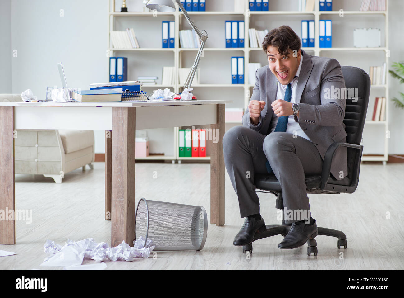 The businessman having fun taking a break in the office at work Stock ...