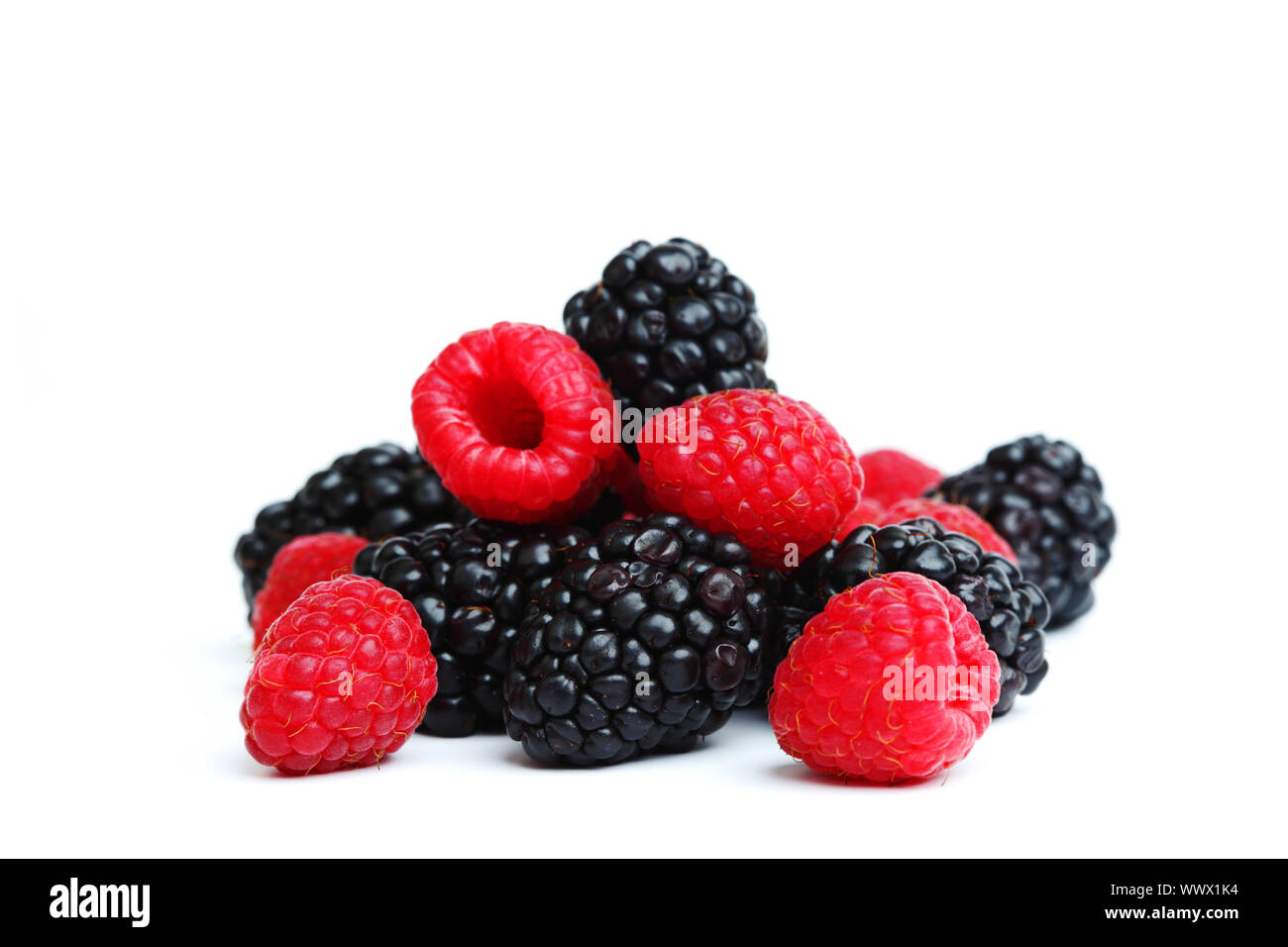 berry mixed pile on black background Stock Photo - Alamy