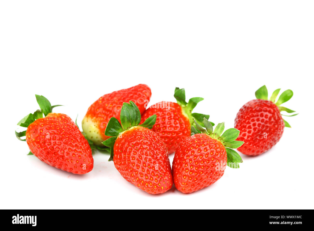 strawberry pile isolated on white background Stock Photo - Alamy