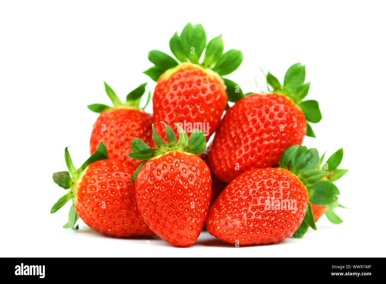 strawberry pile isolated on white background Stock Photo - Alamy
