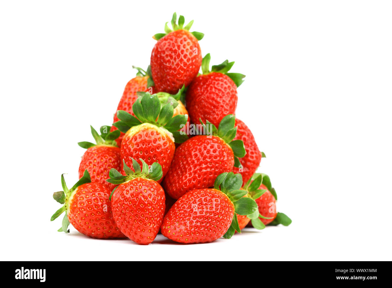 strawberry pile isolated on white background Stock Photo - Alamy