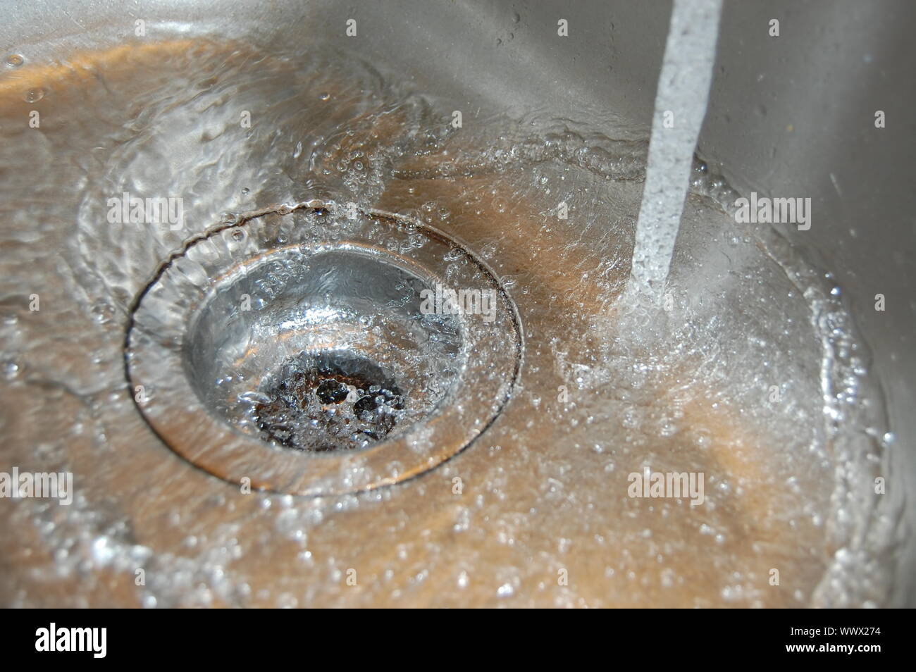 water flow into the drain in the kitchen Stock Photo - Alamy