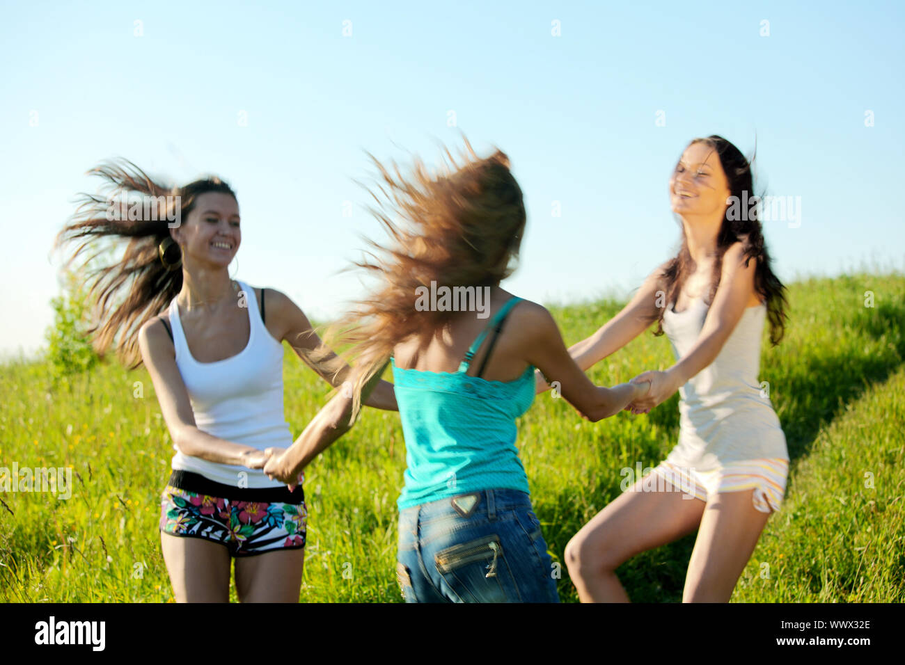 women fun on grass field Stock Photo - Alamy