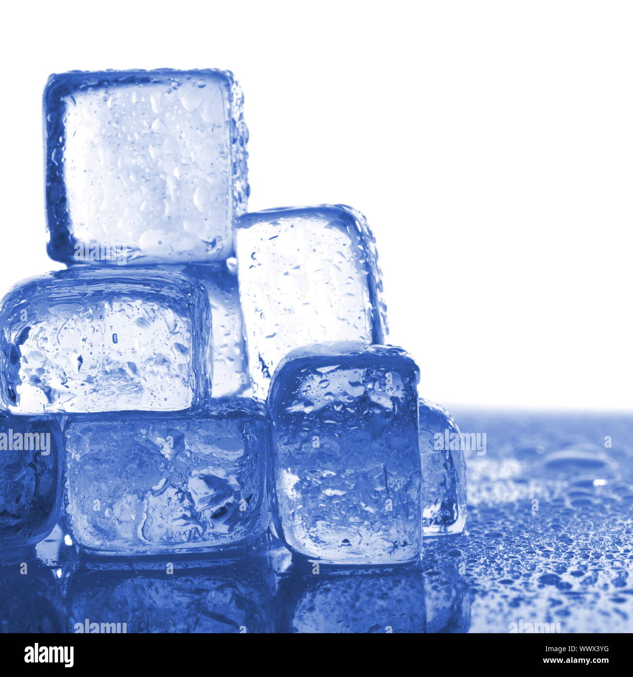cool ice cubes isolated in white background Stock Photo - Alamy