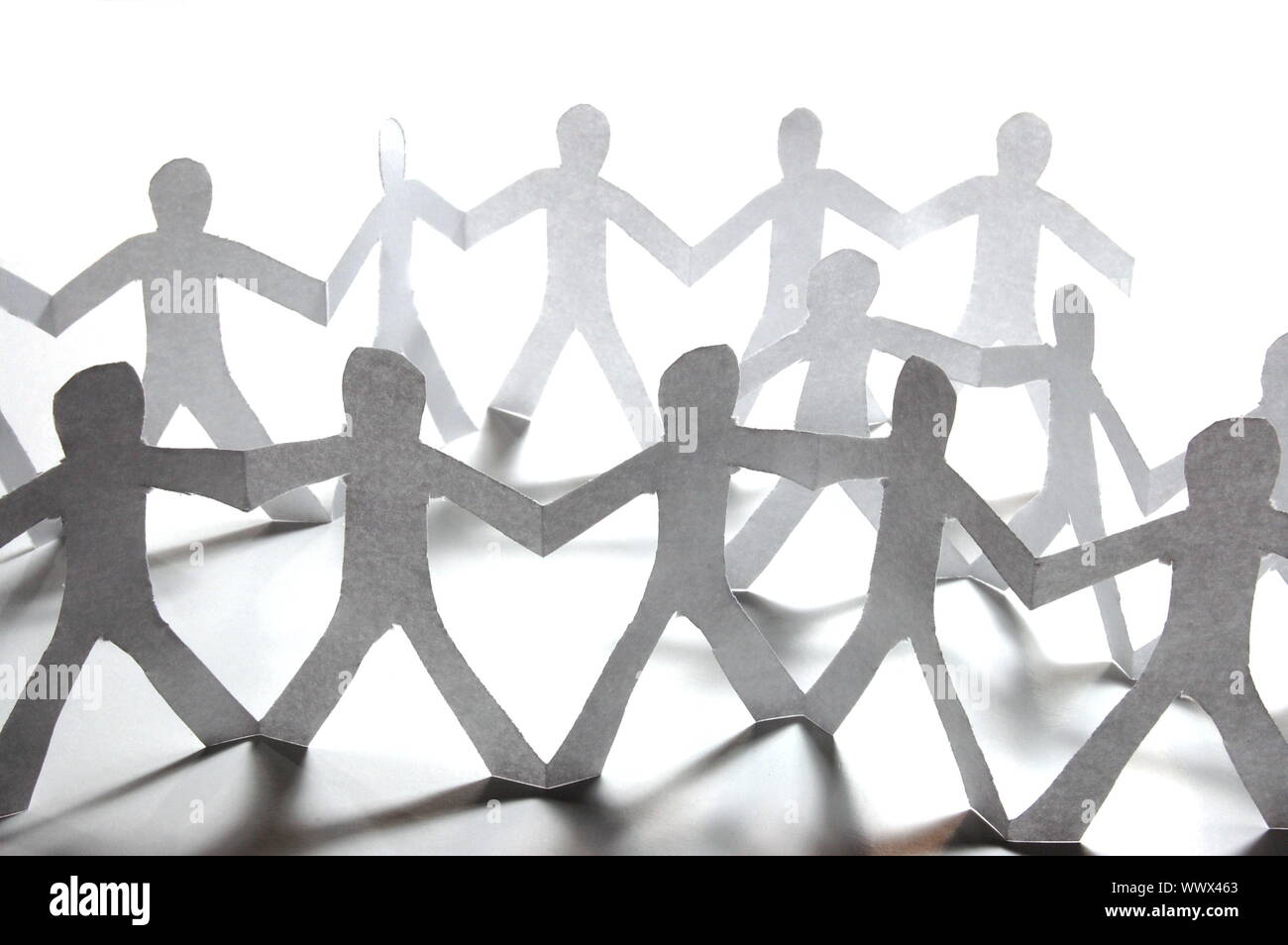 paper people doing teamwork in their business Stock Photo - Alamy