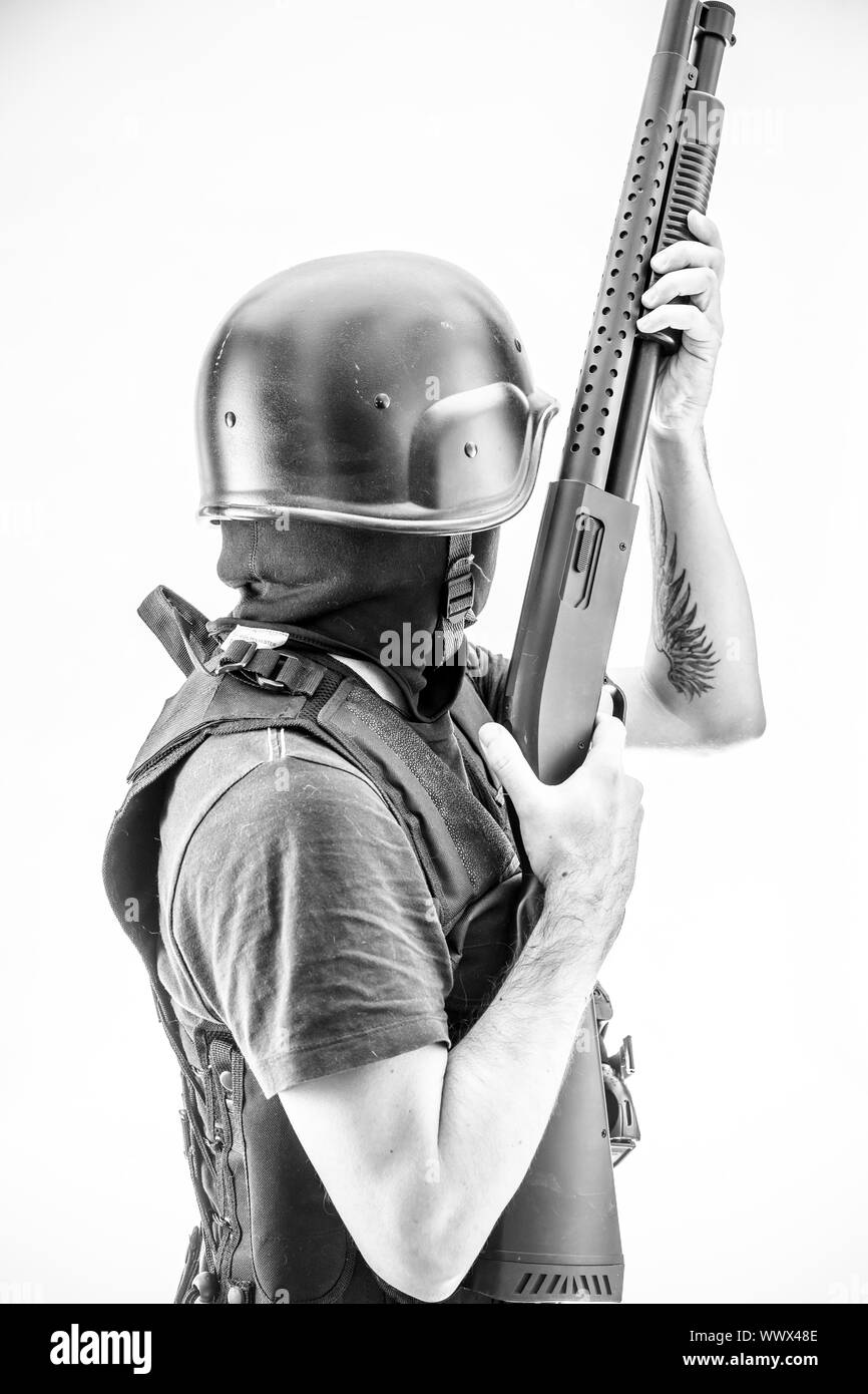 man armed with balaclava and bulletproof vest, gun and shotgun ...