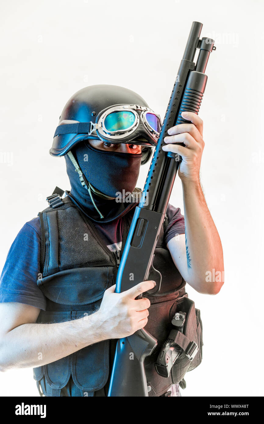 Terrorism, man armed with balaclava and bulletproof vest, gun and ...